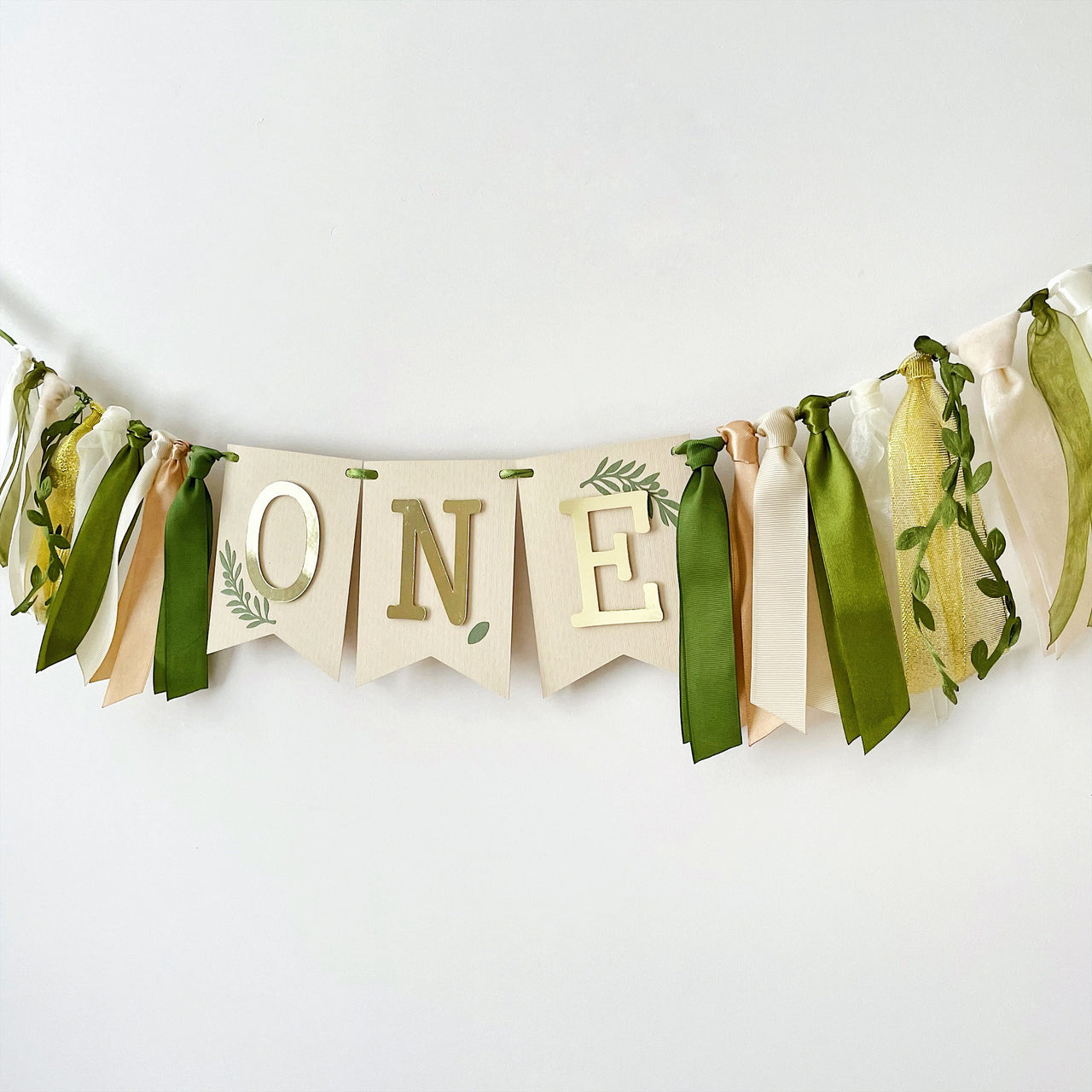 Greenery-style design for a baby's first birthday